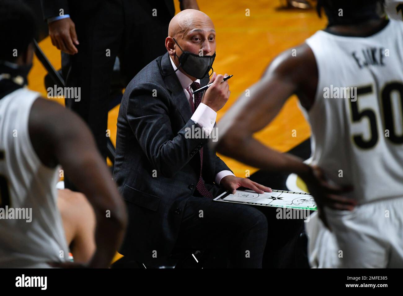Vanderbilt head coach Jerry Stackhouse talks to players during a time ...
