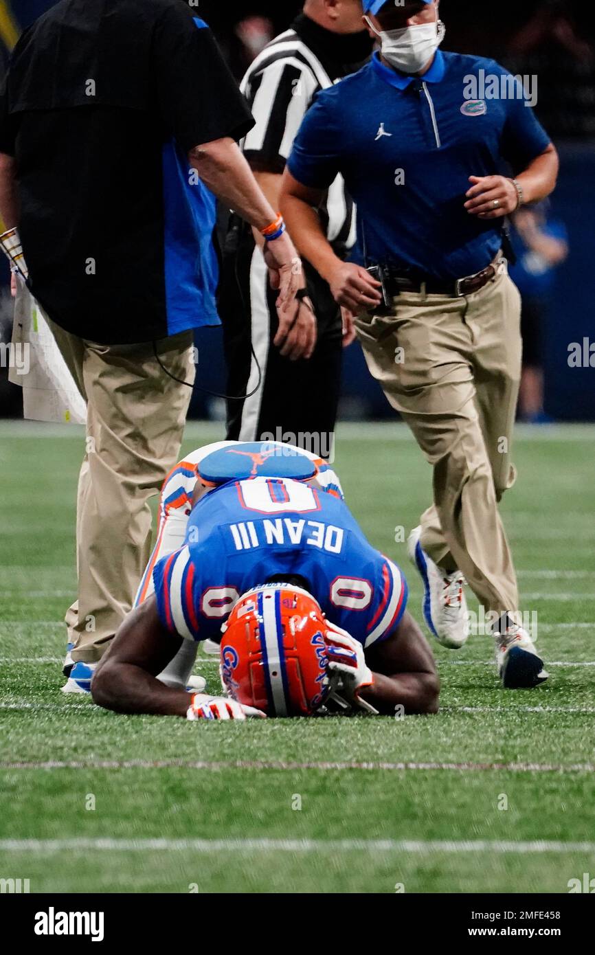 Florida defensive back Trey Dean III (0) lays on the field injured ...