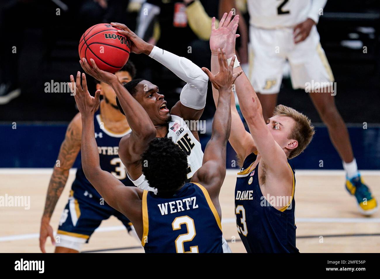 Purdue guard Brandon Newman (5) shoots over Notre Dame guards Trey ...