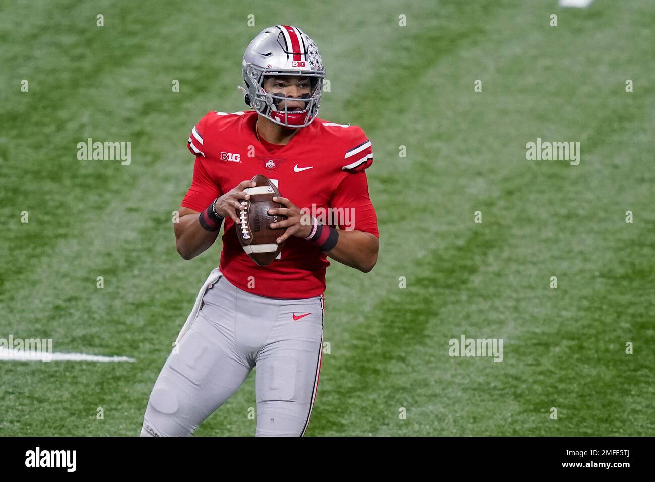Ohio State quarterback Justin Fields drops back to pass during the ...