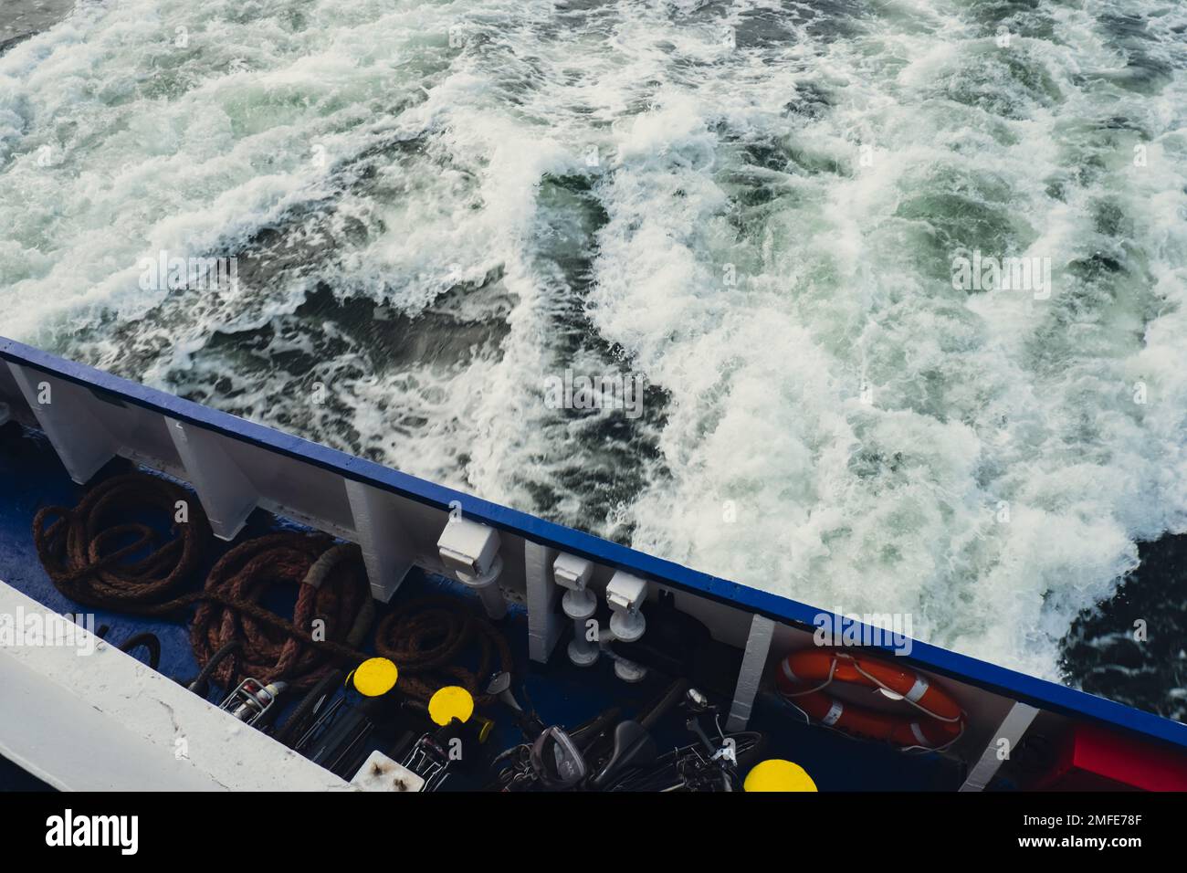 Wake of vessel. Wide wake trail from boat. Ocean water. Deep blue ...