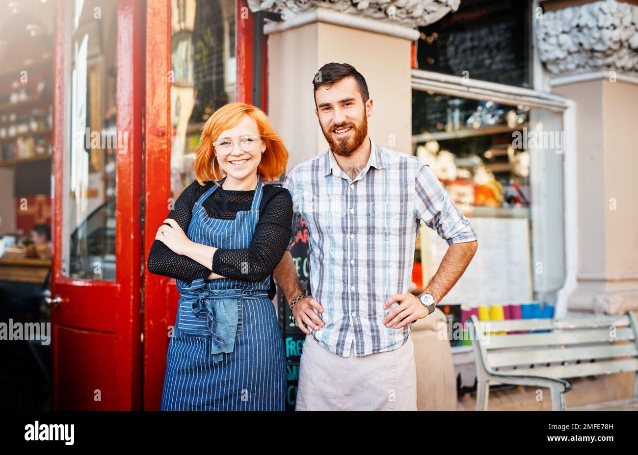 Our doors are open. co-owners standing outside their coffee shop Stock ...