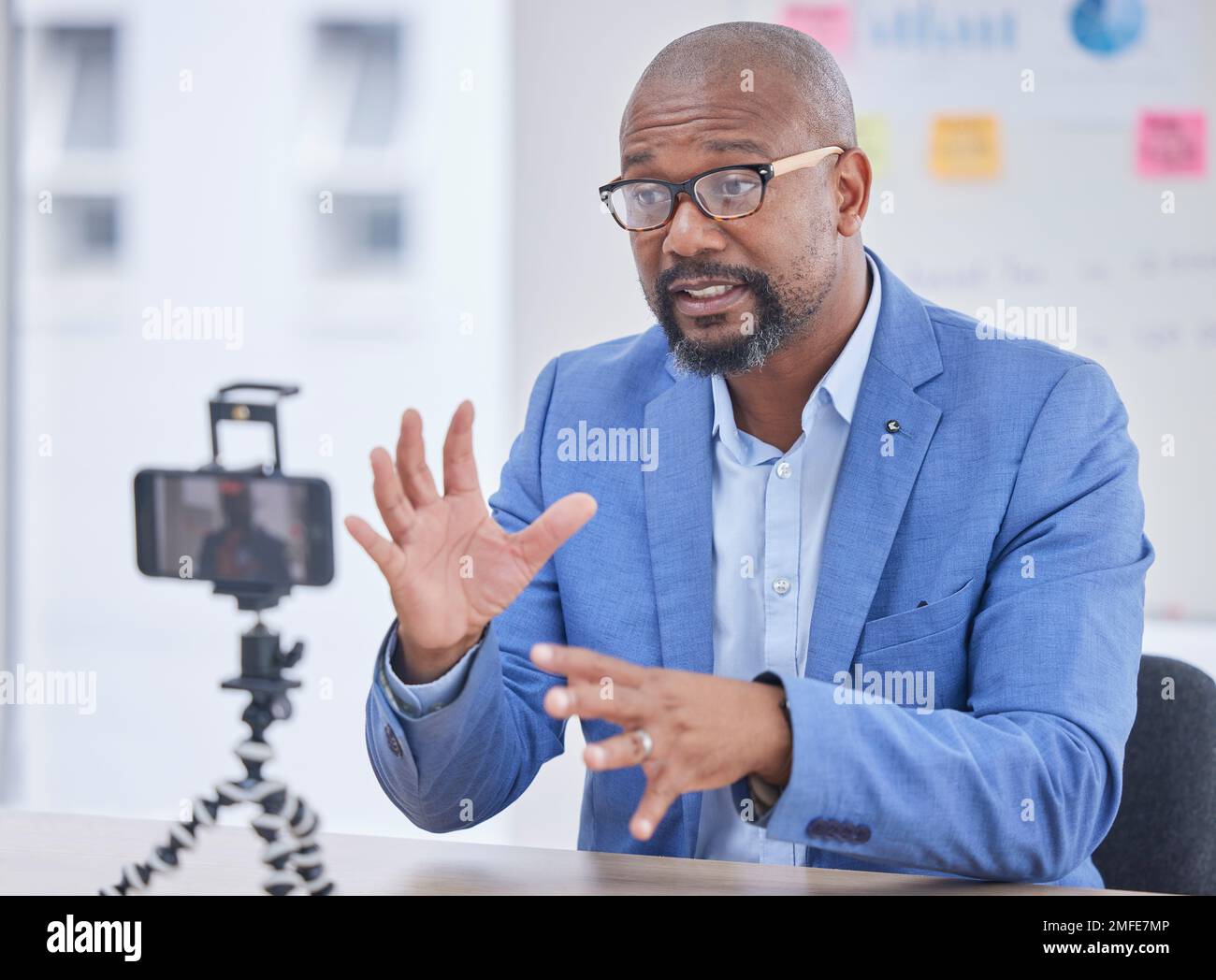 Smartphone, business webinar and black man talking for coaching ...