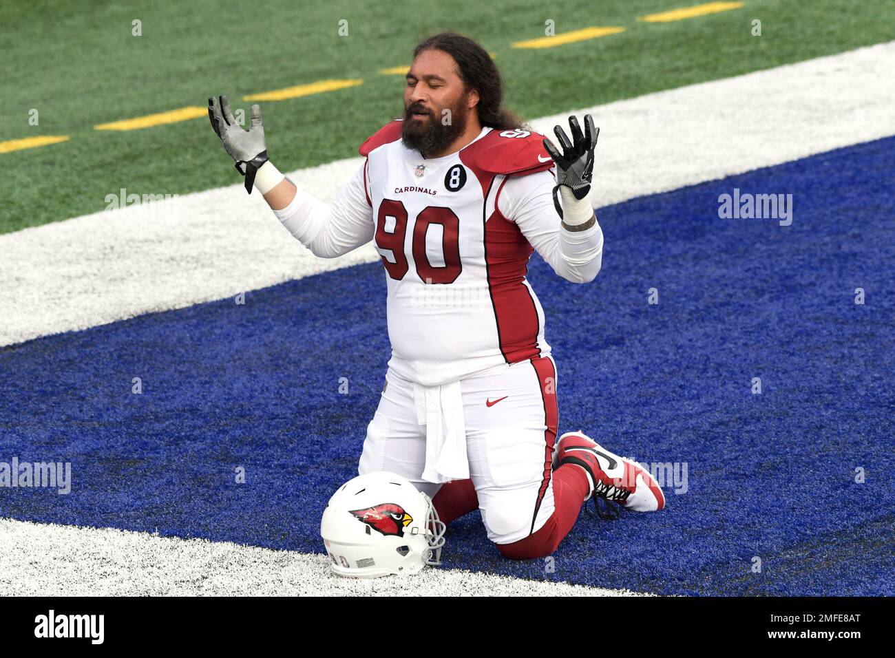 Arizona Cardinals defensive lineman Domata Peko prays before an NFL ...