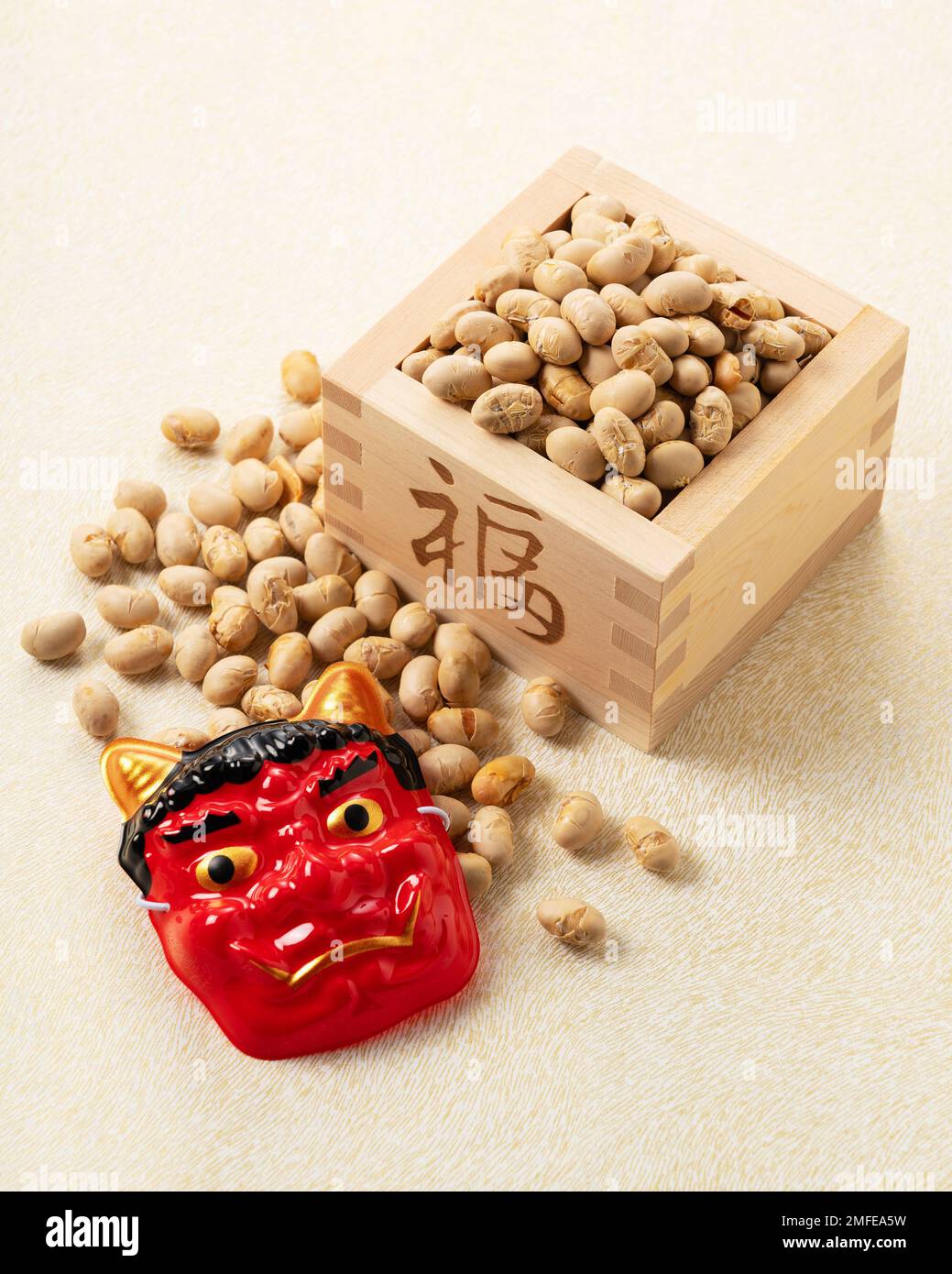 Beans for bean-throwing and masks of ogres placed on a Japanese-style ...