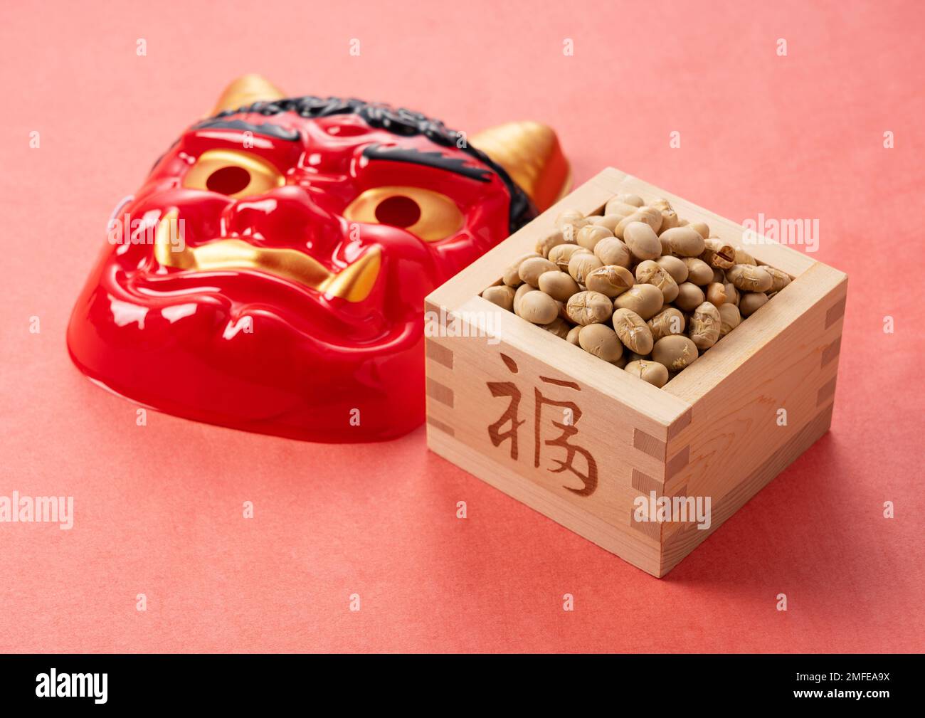 Beans for bean-throwing and masks of ogres placed on a background of ...