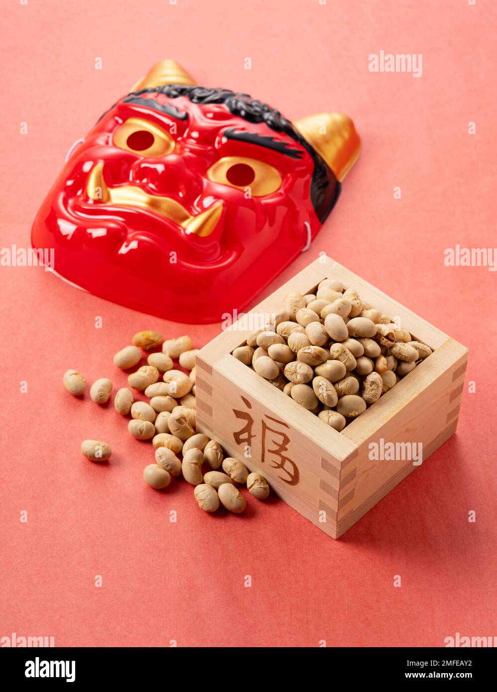 Beans for bean-throwing and masks of ogres placed on a background of ...