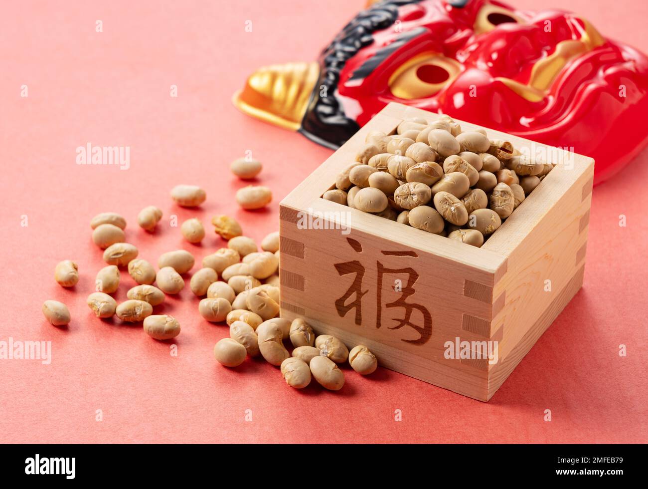 Beans for bean-throwing and masks of ogres placed on a background of ...