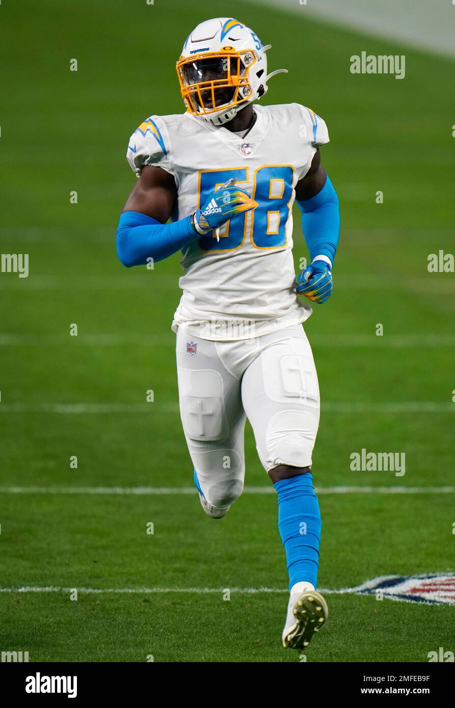 Los Angeles Chargers linebacker B.J. Bello #58 runs down field to cover ...