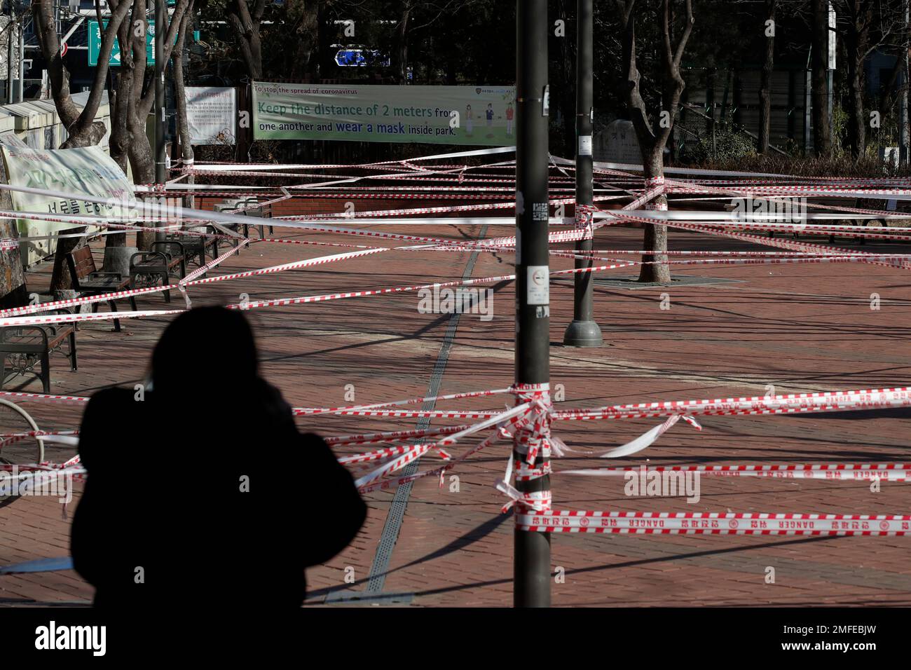 A park is taped off for the social distancing measures and a precaution ...