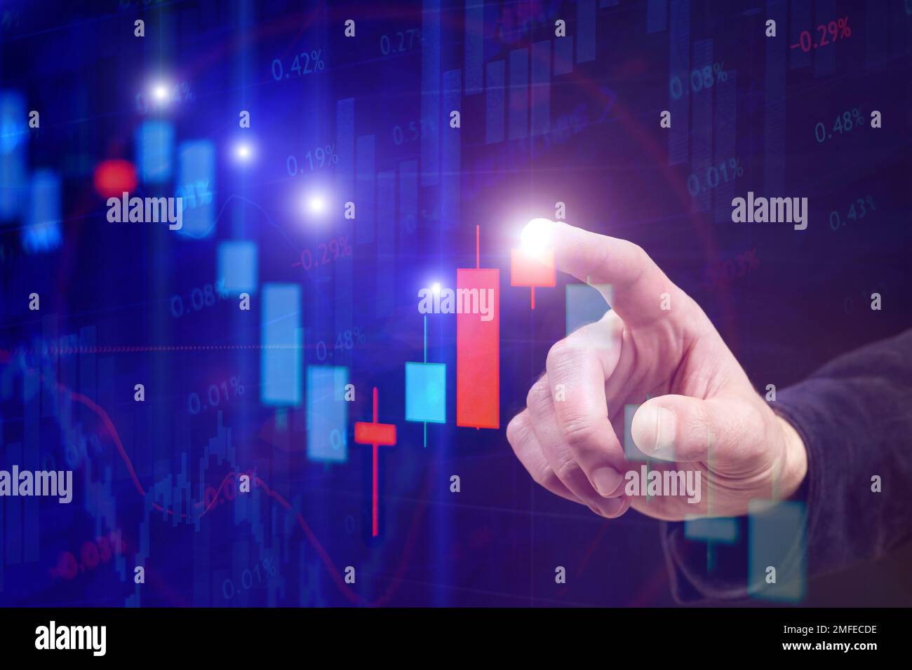 The trader points his finger at the stock chart on the monitor Stock ...