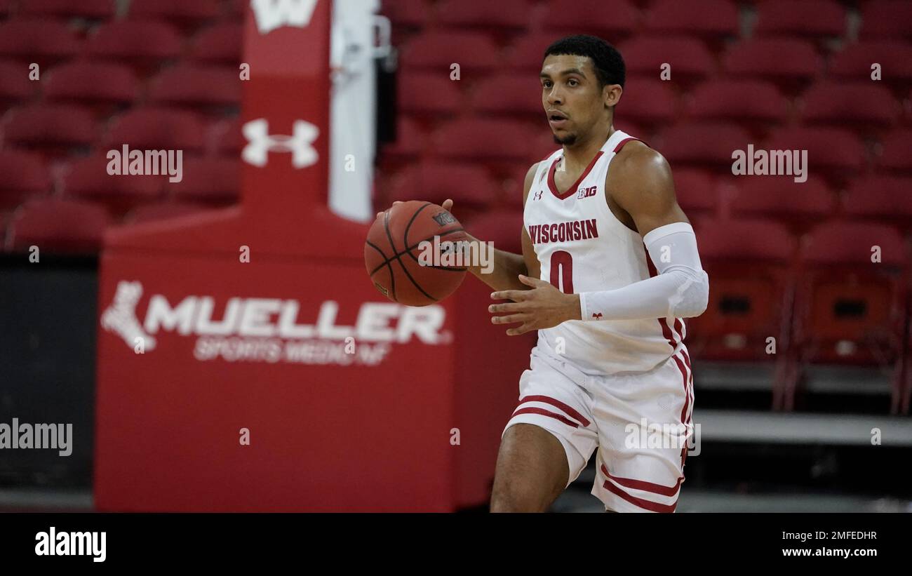 Wisconsin's D'Mitrik Trice dribbles during the first half of an NCAA ...