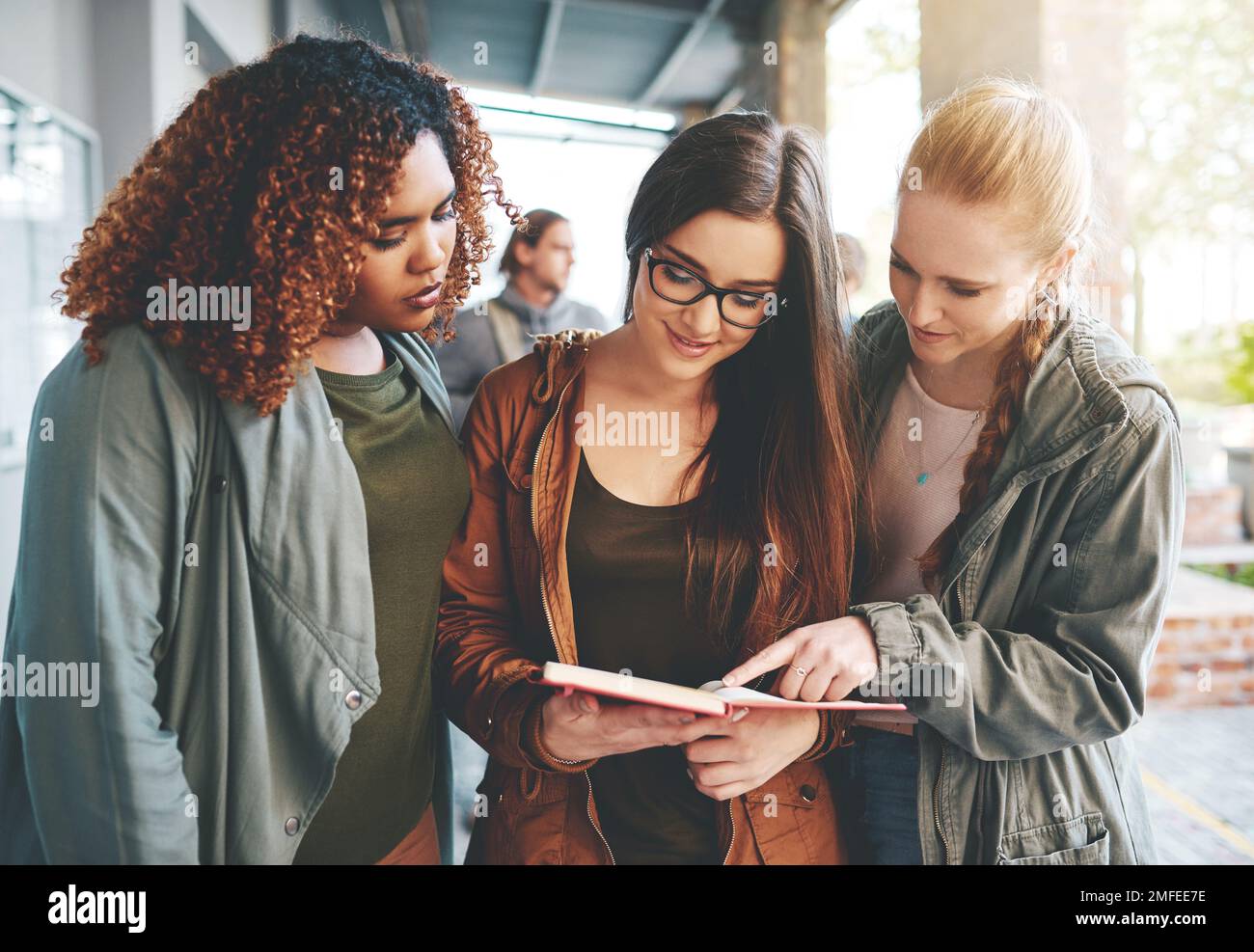 It pays to share the knowledge. a group of young students reading a ...
