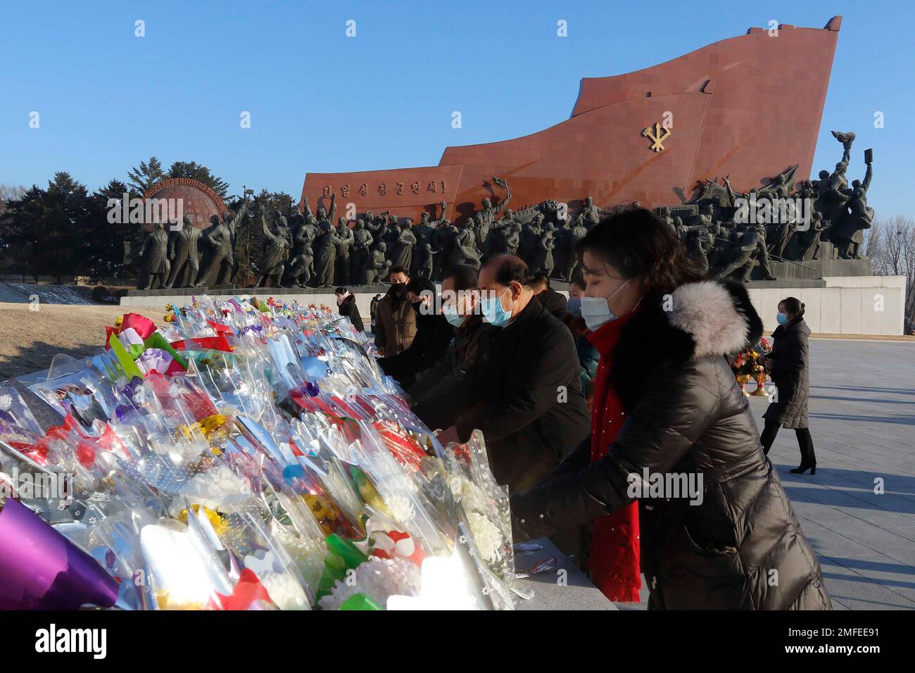Pyongyang citizens visit Mansu Hill to offer the bouquets of flowers to ...