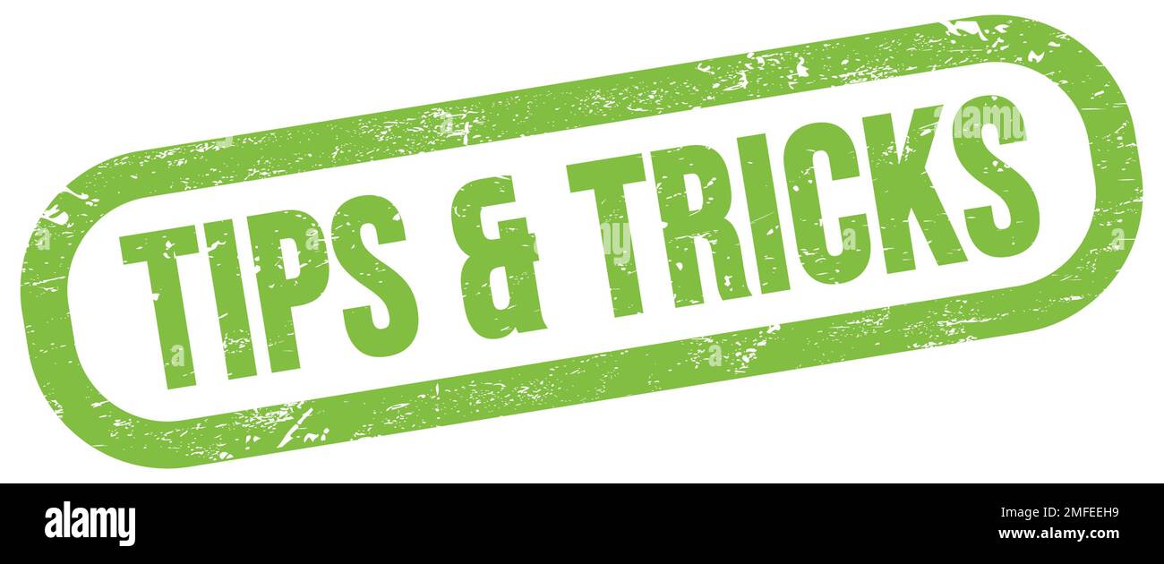 TIPS & TRICKS, text on green rectangle stamp sign Stock Photo - Alamy