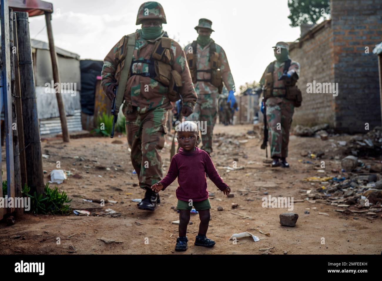 South African National Defense Forces patrol the Sjwetla informal ...
