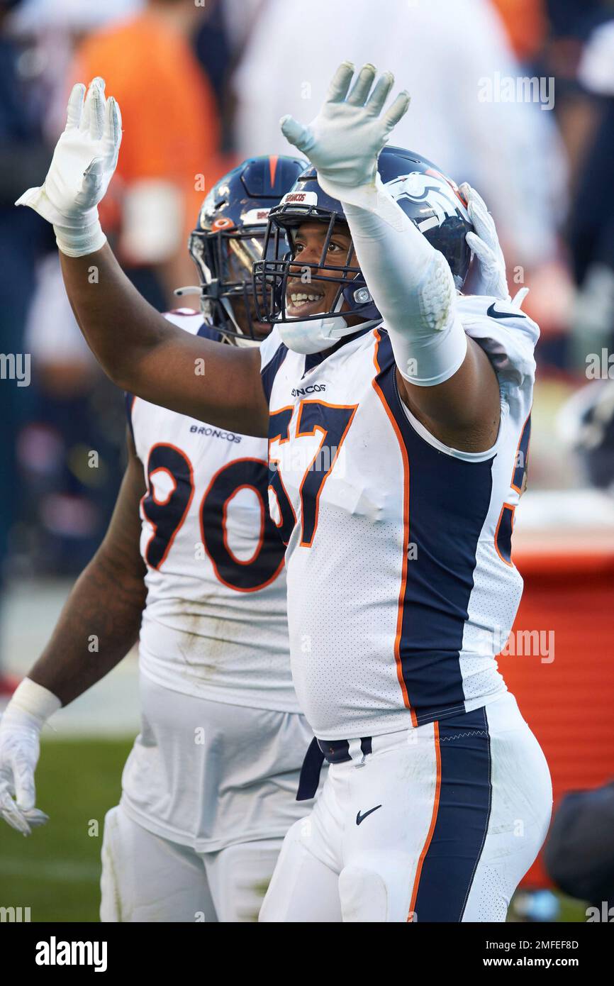 Denver Broncos defensive end DeMarcus Walker (57) waves to the crowd ...