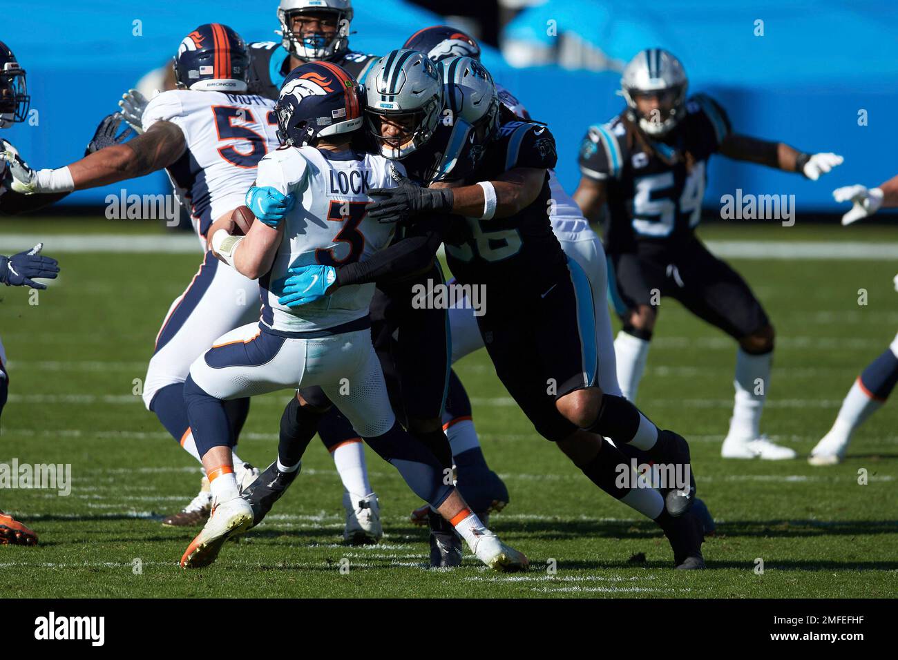 Denver Broncos quarterback Drew Lock (3) is sacked by Carolina Panthers ...