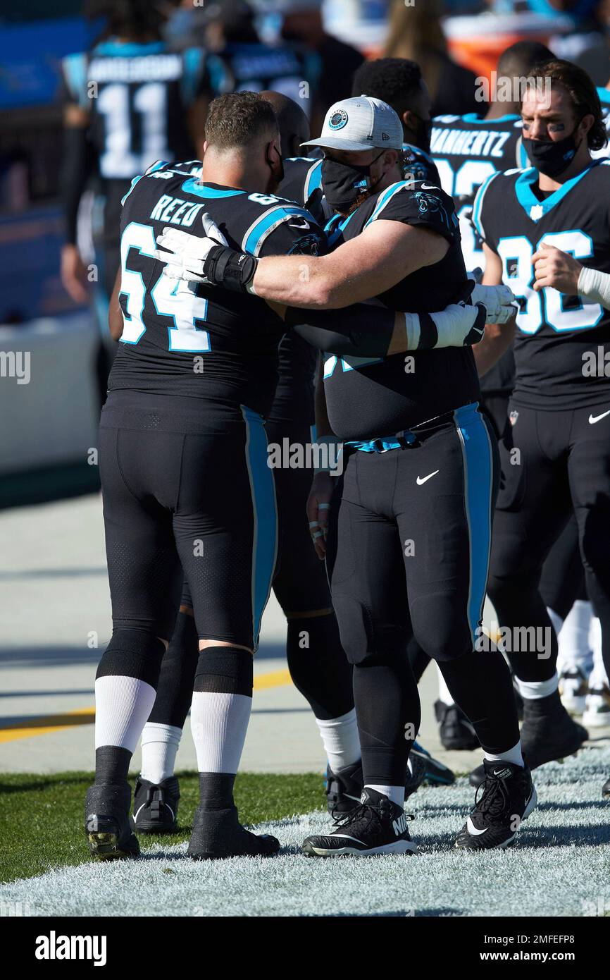 Carolina Panthers offensive lineman Chris Reed (64) gets a hug from ...