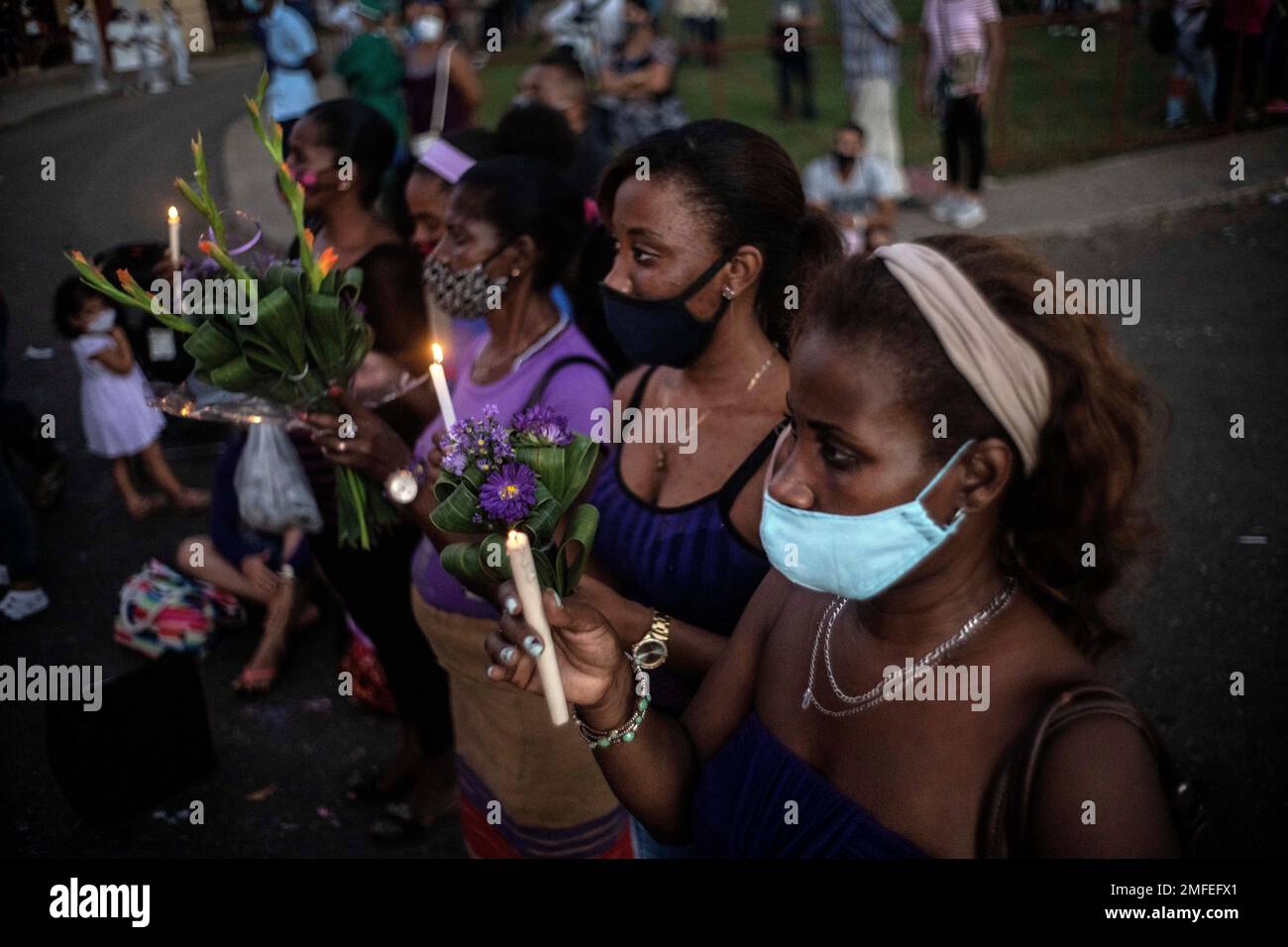 Followers of Saint Lazaro pray during the pilgrimage to the saint's ...