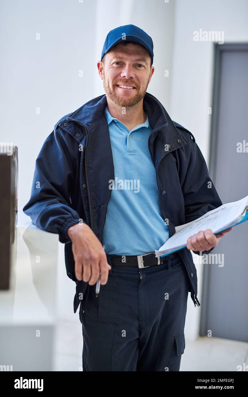 Your package will always be on time. Cropped portrait of a handsome ...