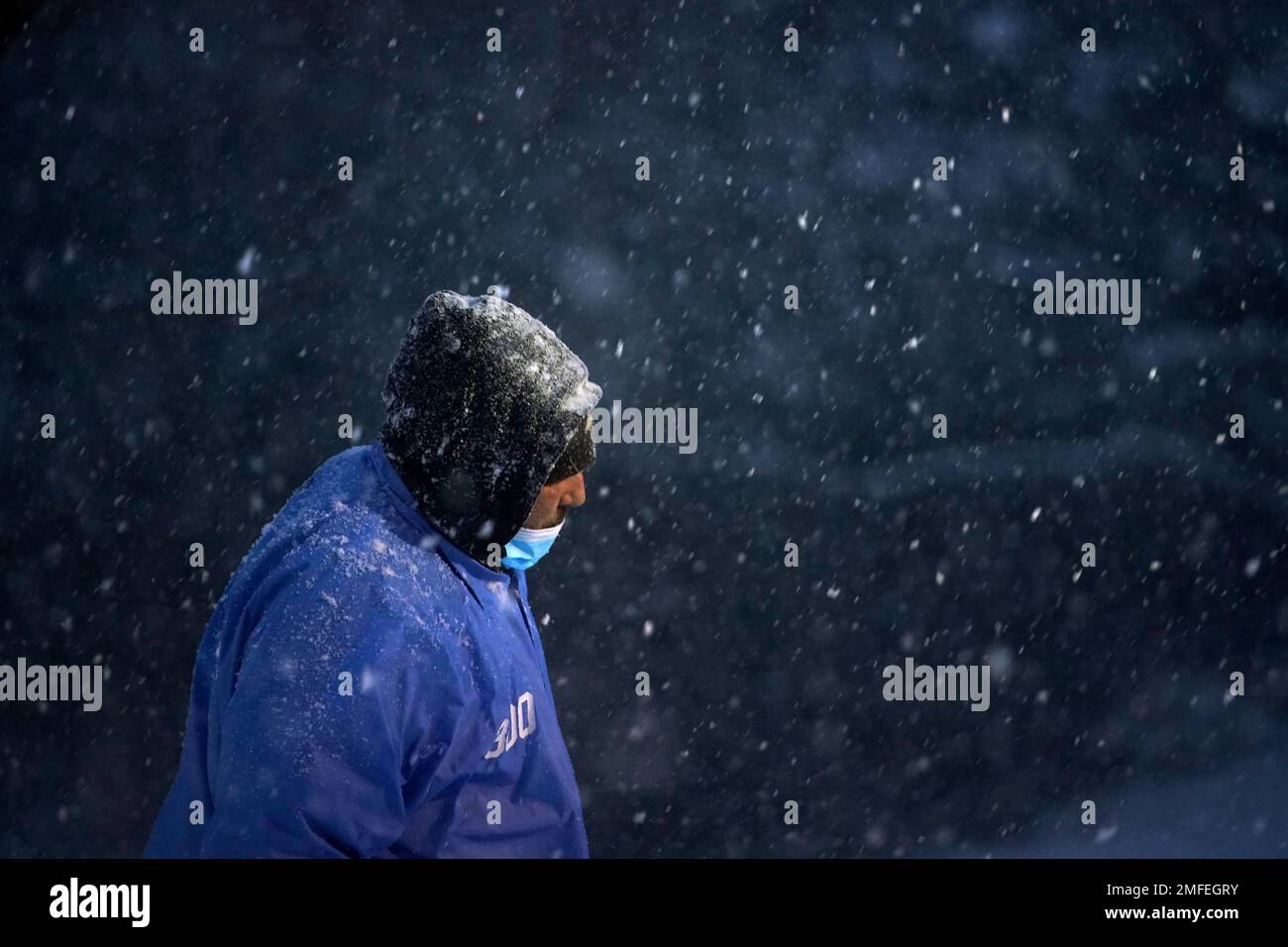 A man walks through the Villanova University campus during a snow storm ...