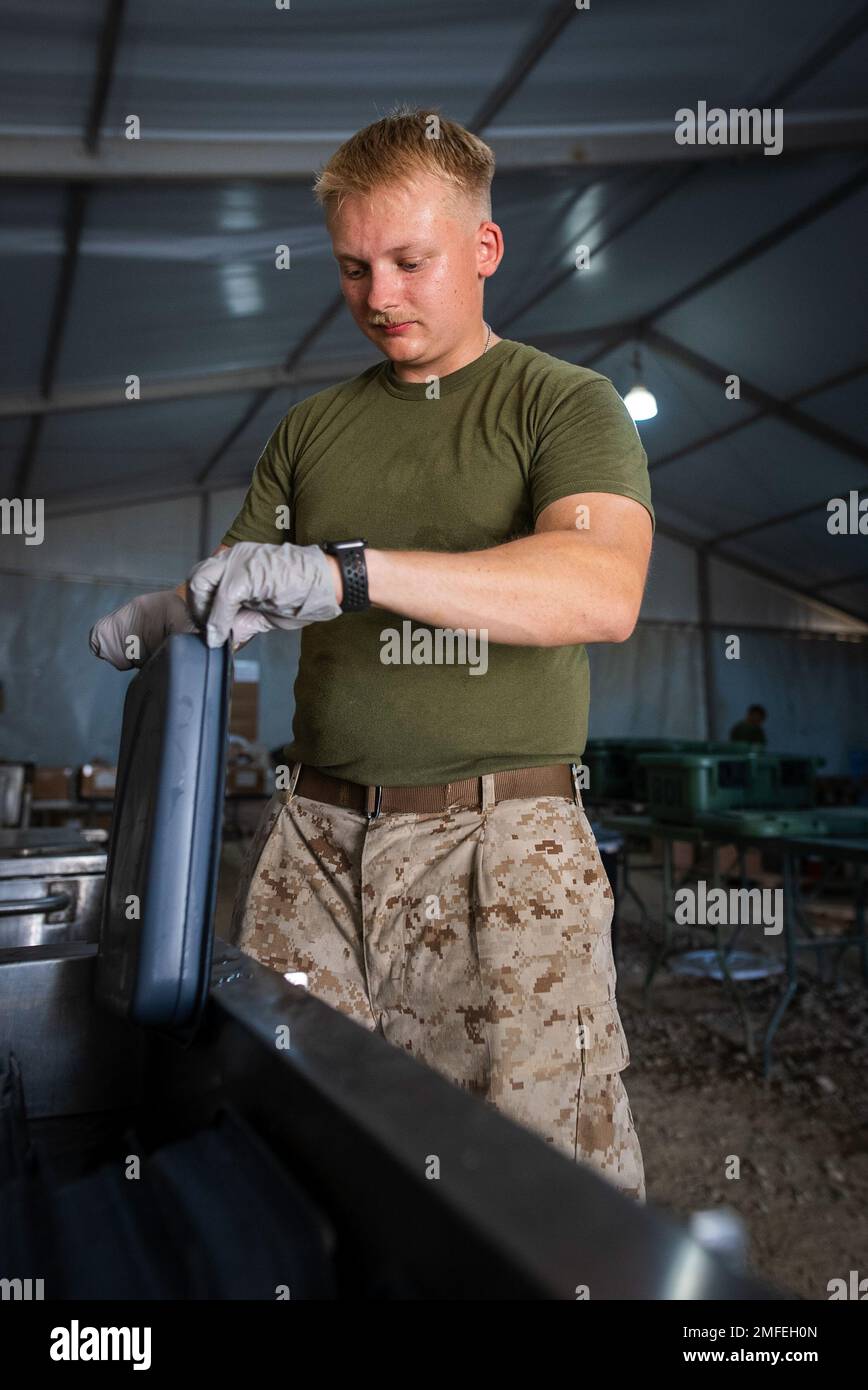 U.S. Marine Corps Sgt. Tanner Malsom, a food service specialist with ...