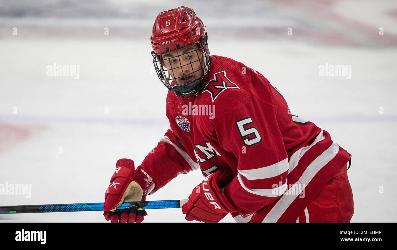 Miami defenseman Jack Clement (5) defending against Nebraska-Omaha ...