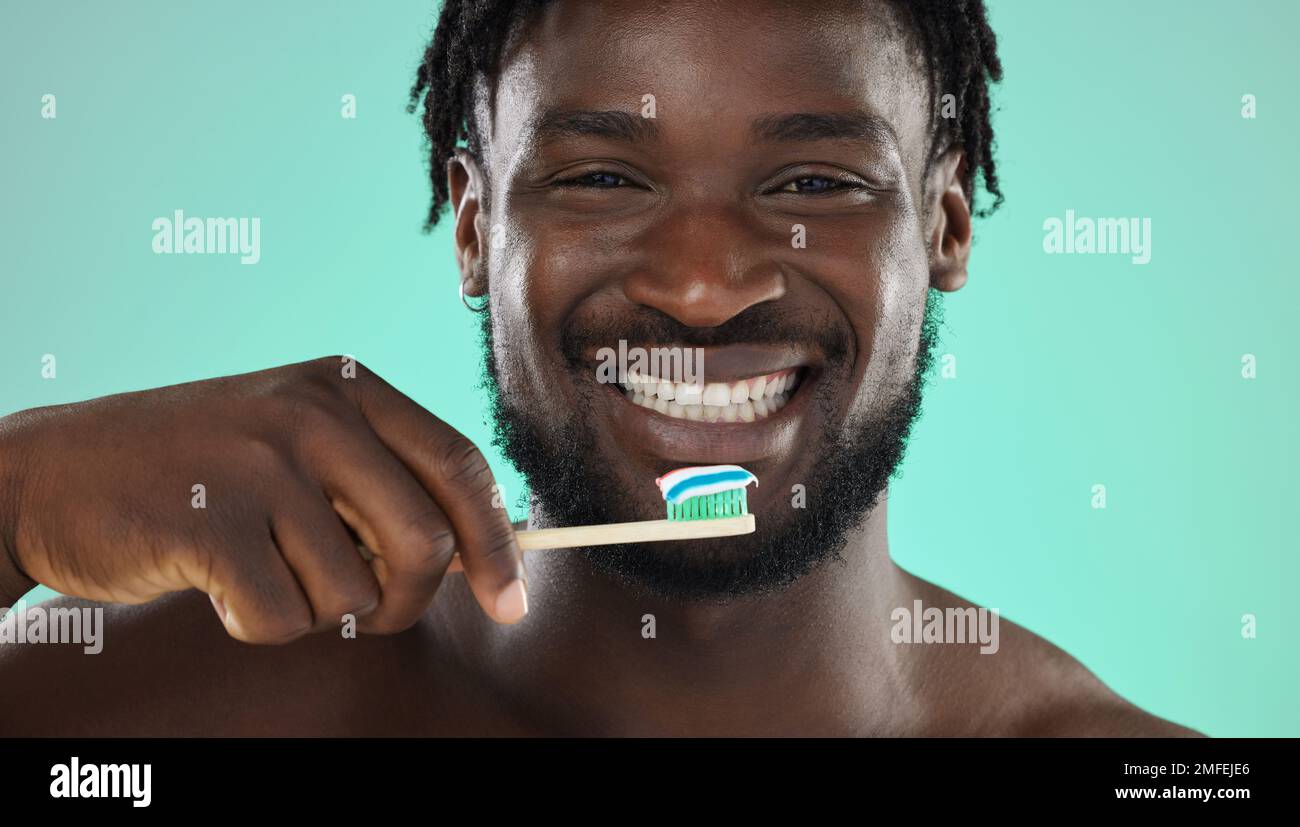 Black man, face and toothbrush, happy portrait with smile for teeth whitening and cleaning mouth ...