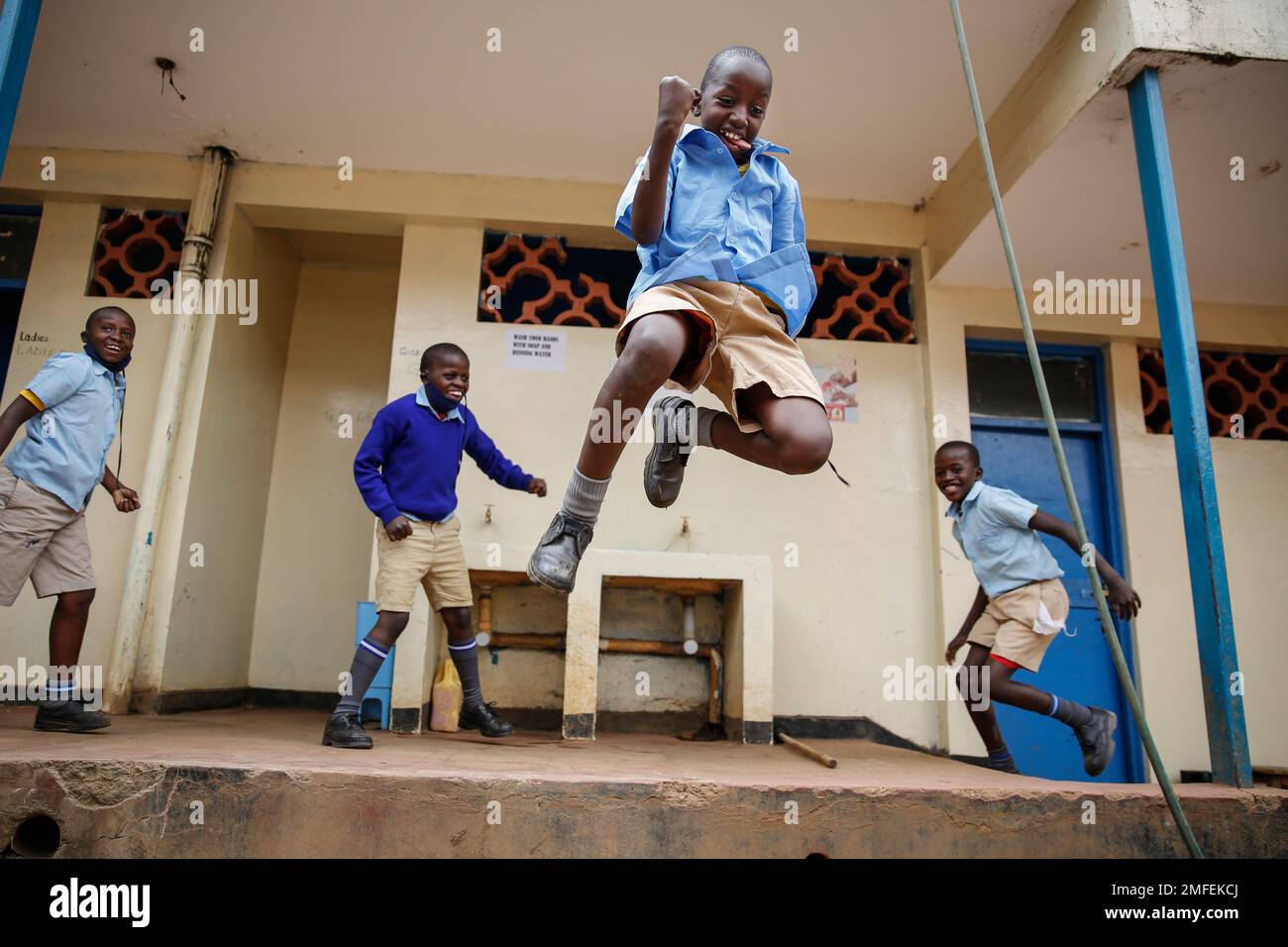 Schoolchildren play at the Olympic Primary School in Kibera, one of ...