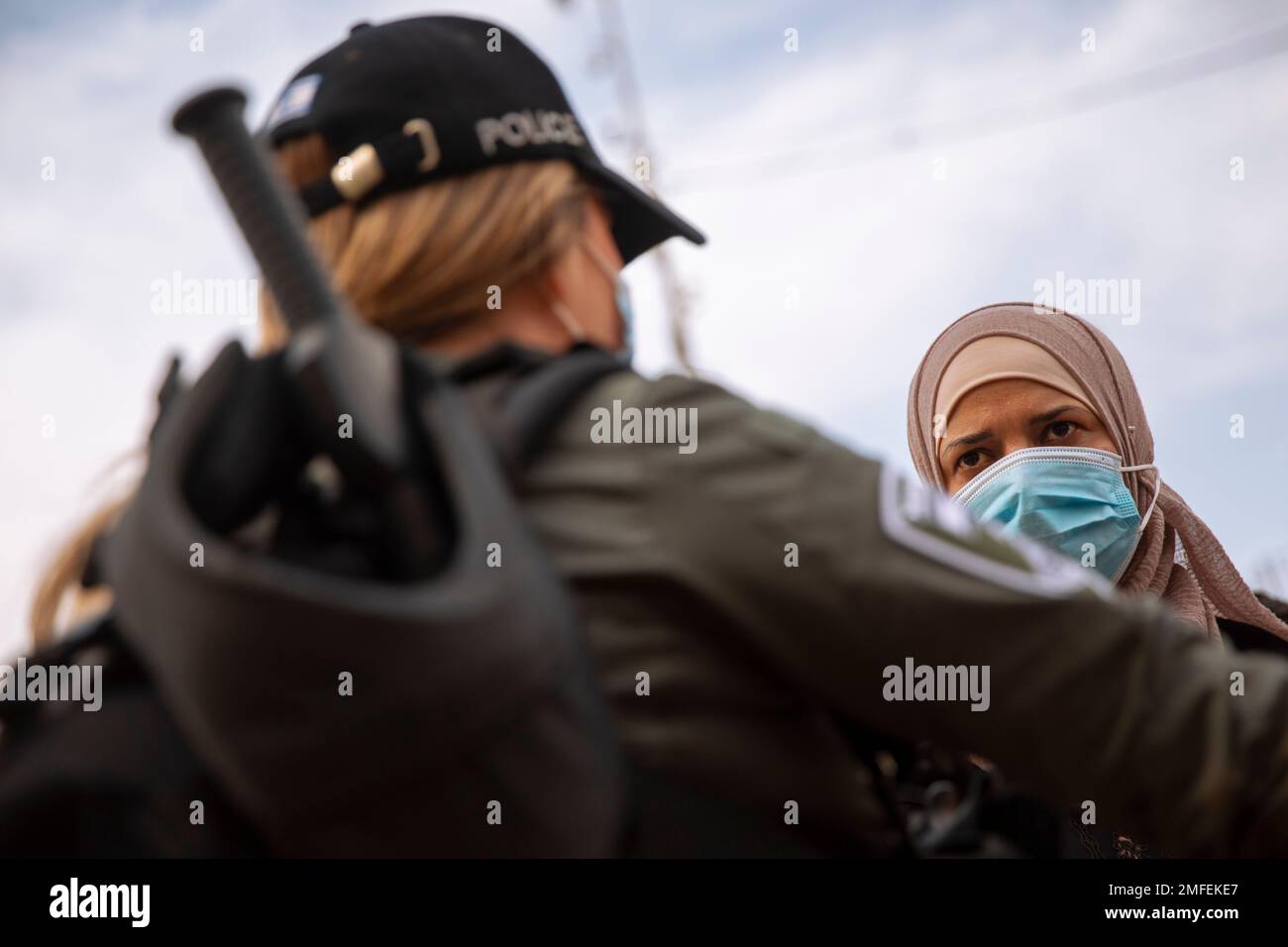 Israeli border police officers check Palestinians' identification cards ...