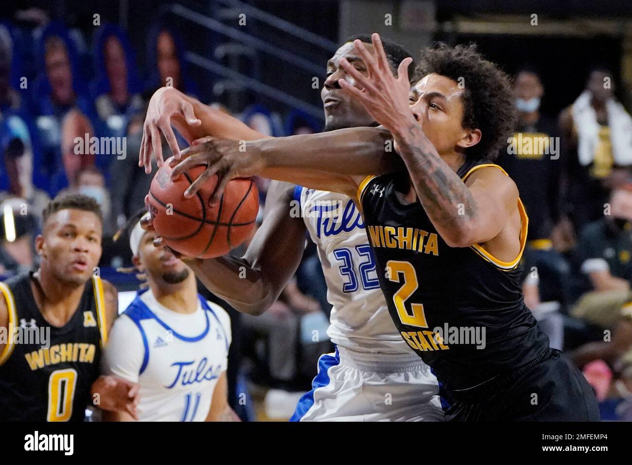 Tulsa guard Austin Richie (32) and Wichita State guard Craig Porter Jr ...