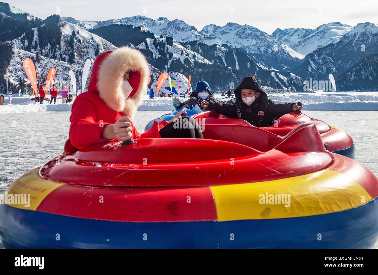 Tianchi. 24th Jan, 2023. People ride snow tubes at Tianchi scenic area ...