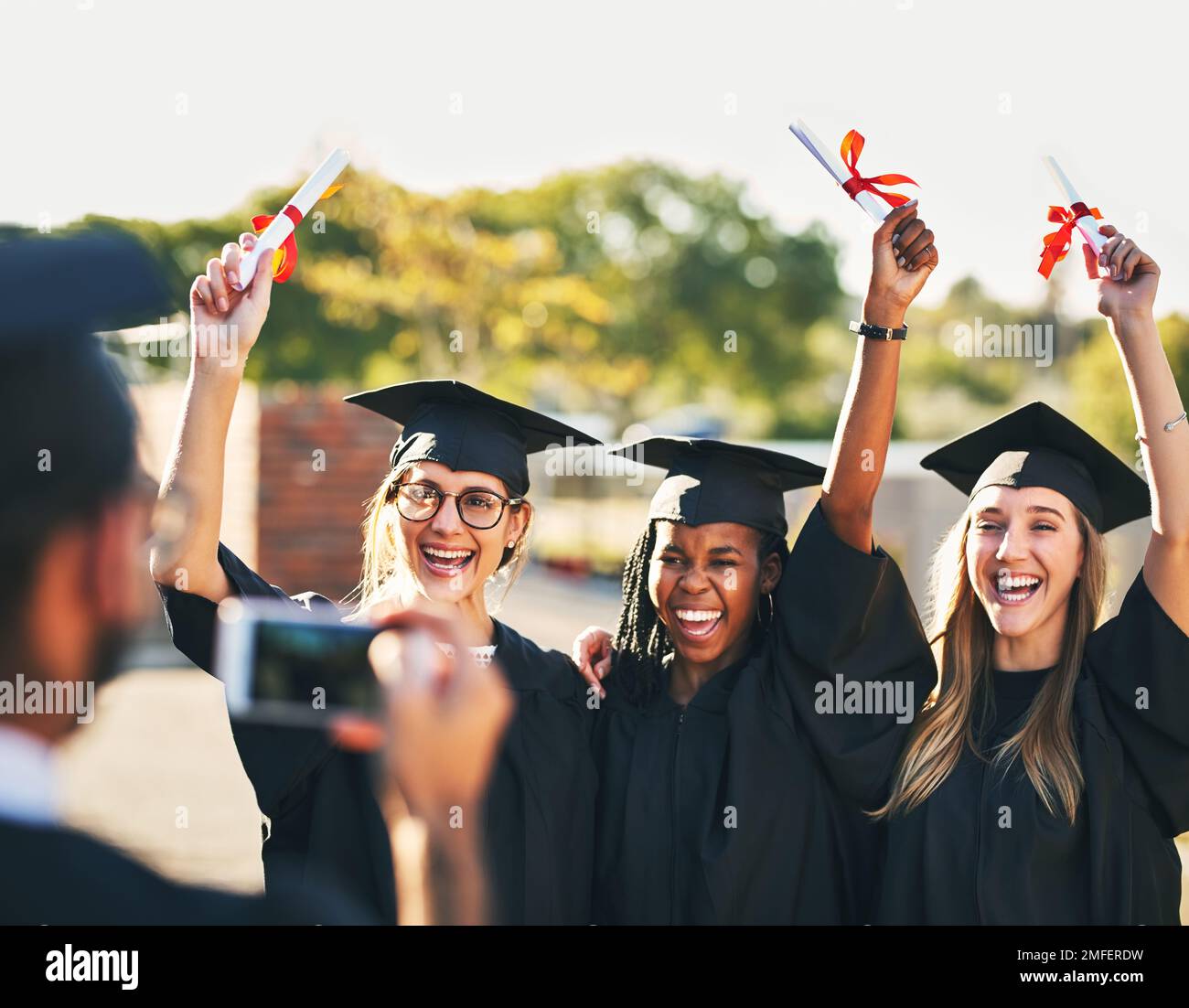 Our future starts now. a group of students taking pictures with a ...