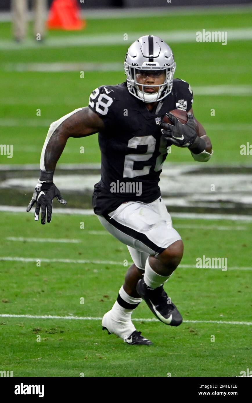 Las Vegas Raiders running back Josh Jacobs (28) runs with the ball ...