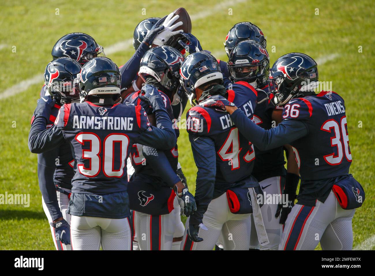 Houston Texans players gather before an NFL football game against the ...