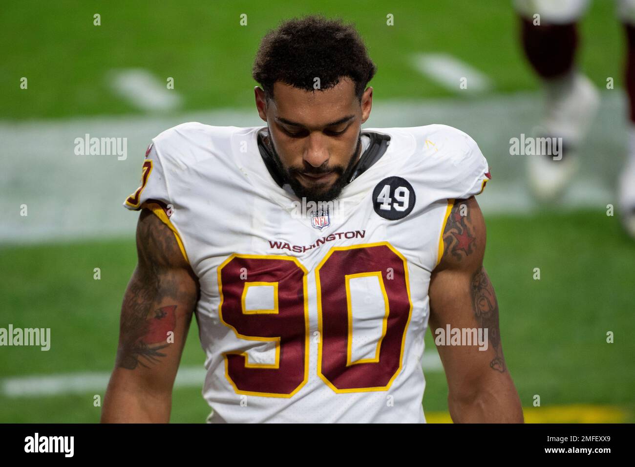Washington Football Team defensive end Montez Sweat (90) walks to the ...