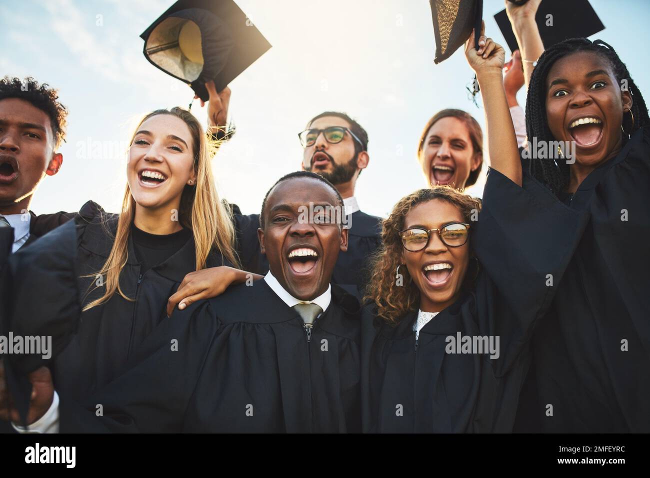 Graduation is an exciting time. a group of cheerful university students ...