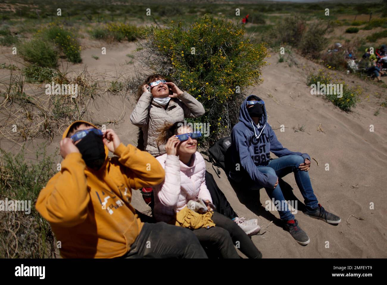People watch a total solar eclipse in Piedra del Aguila, Argentina ...
