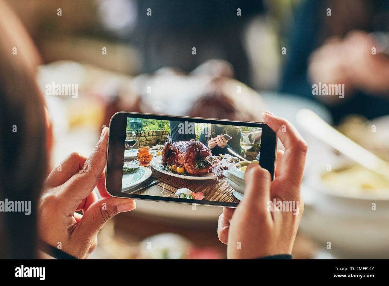 And the turkey always steal the show. a woman taking a picture of a ...