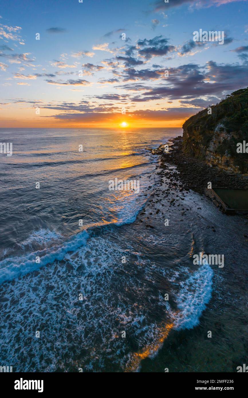 Aerial sunrise seascape with clouds at Macmasters Beach on the Central ...