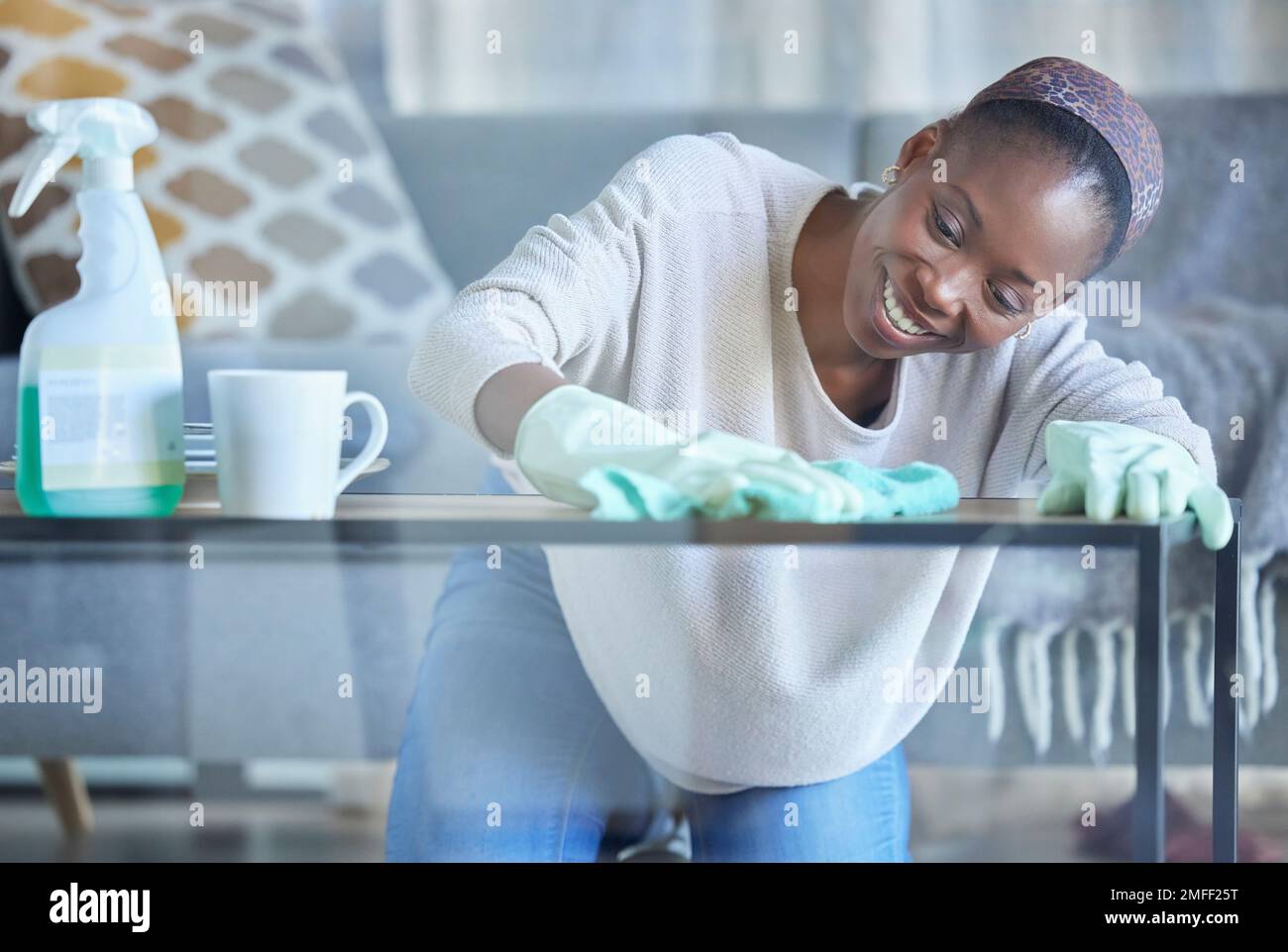 Cleaning, table and black woman with cloth in home for dirt, dust and ...