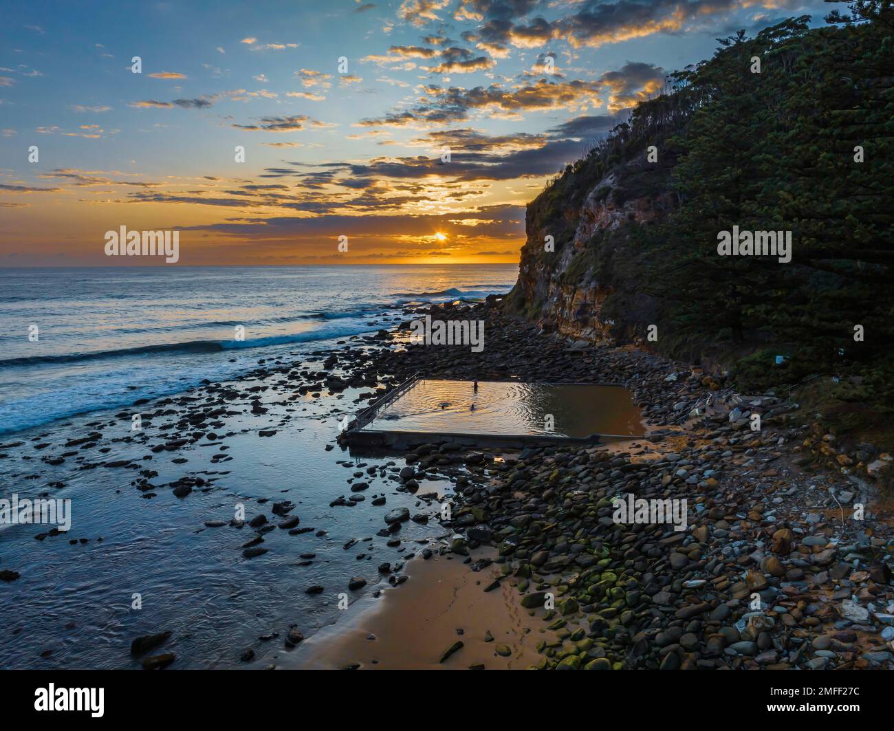 Aerial sunrise seascape with clouds at Macmasters Beach on the Central ...