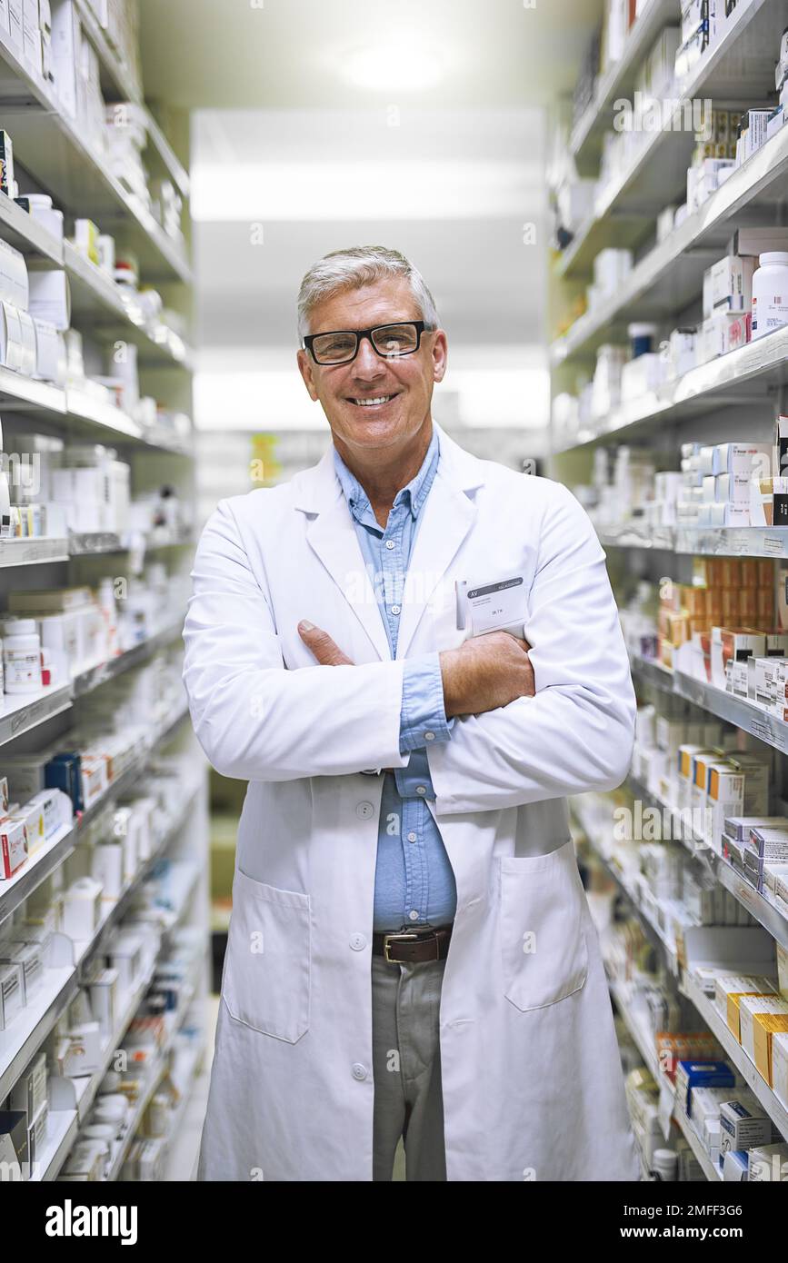 Medication for days. Portrait of a cheerful mature male pharmacist ...