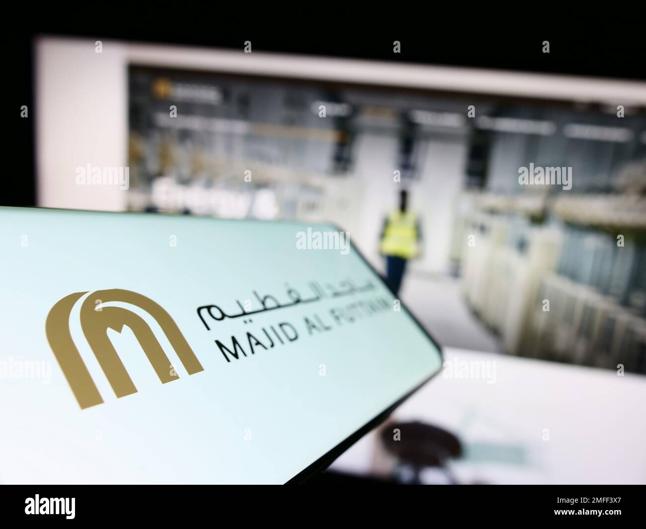 Mobile phone with logo of Emirati company Majid Al Futtaim Group on ...