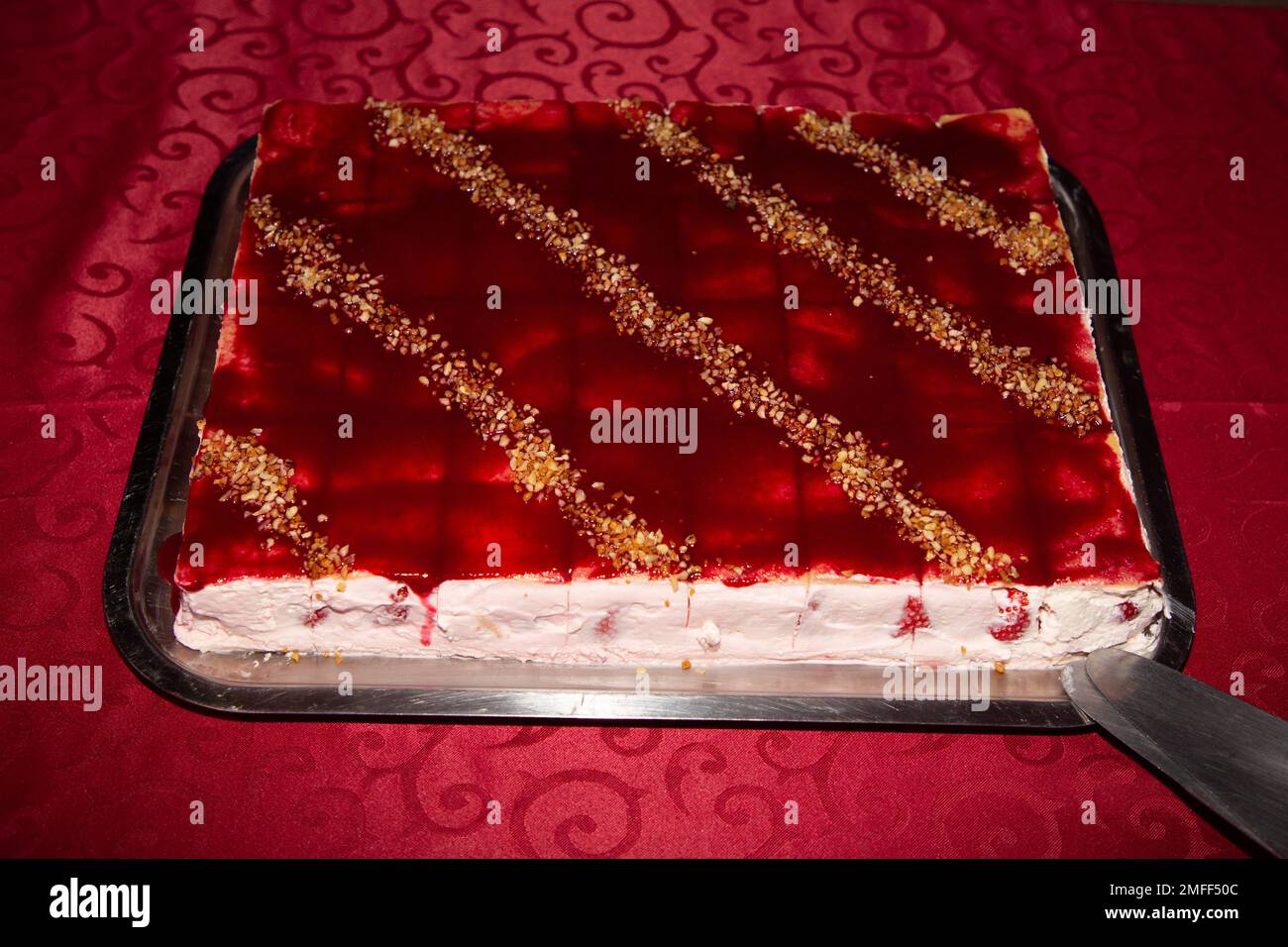 Cold cheesecake with strawberry on party table Stock Photo - Alamy
