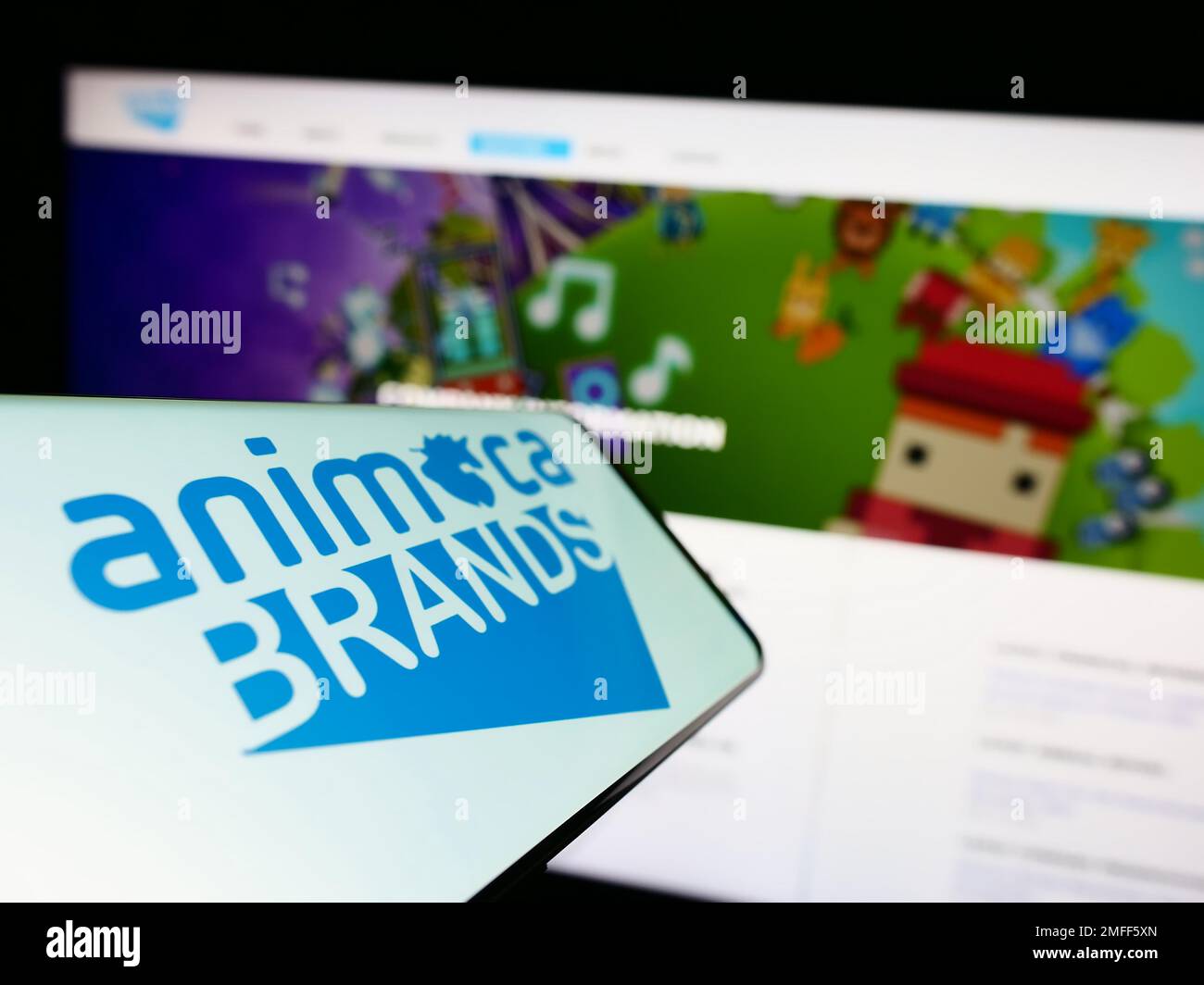 Mobile phone with logo of software company Animoca Brands Corporation ...