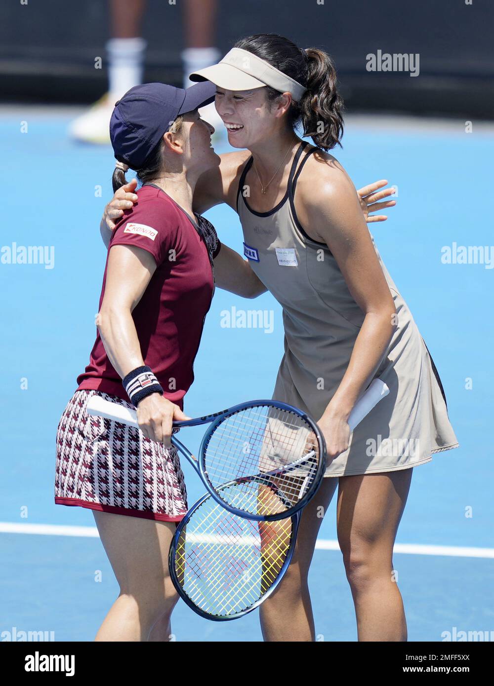 Japan's Shuko Aoyama (L) and Ena Shibahara hug after defeating American ...