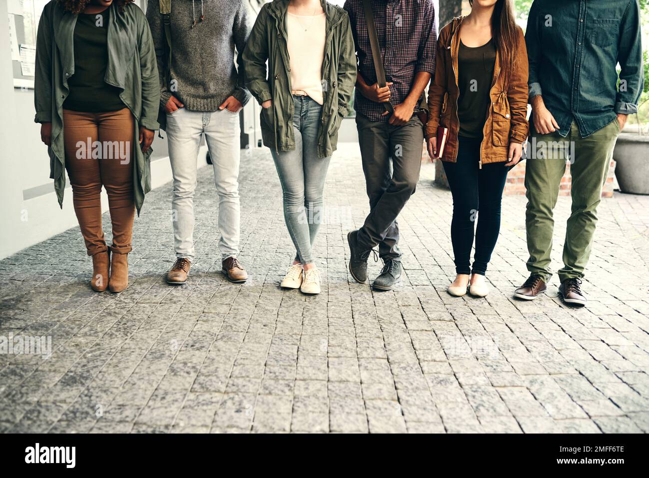 Taking steps to ensure their future. a group of young students standing ...