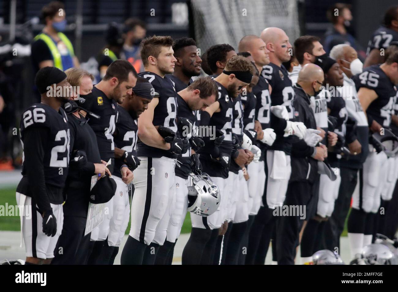 Las Vegas Raiders stand during the national anthem before an NFL ...